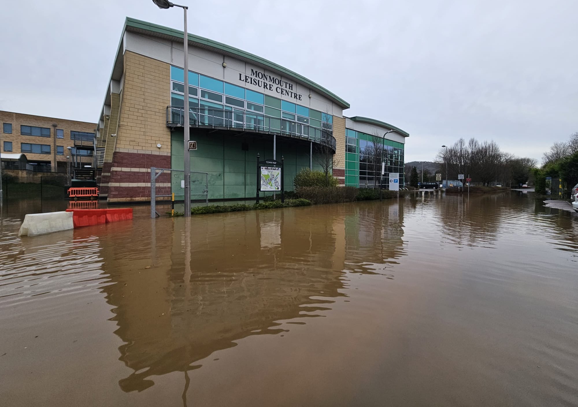 Flooding through drains closes road and Monmouth Leisure Centre ...